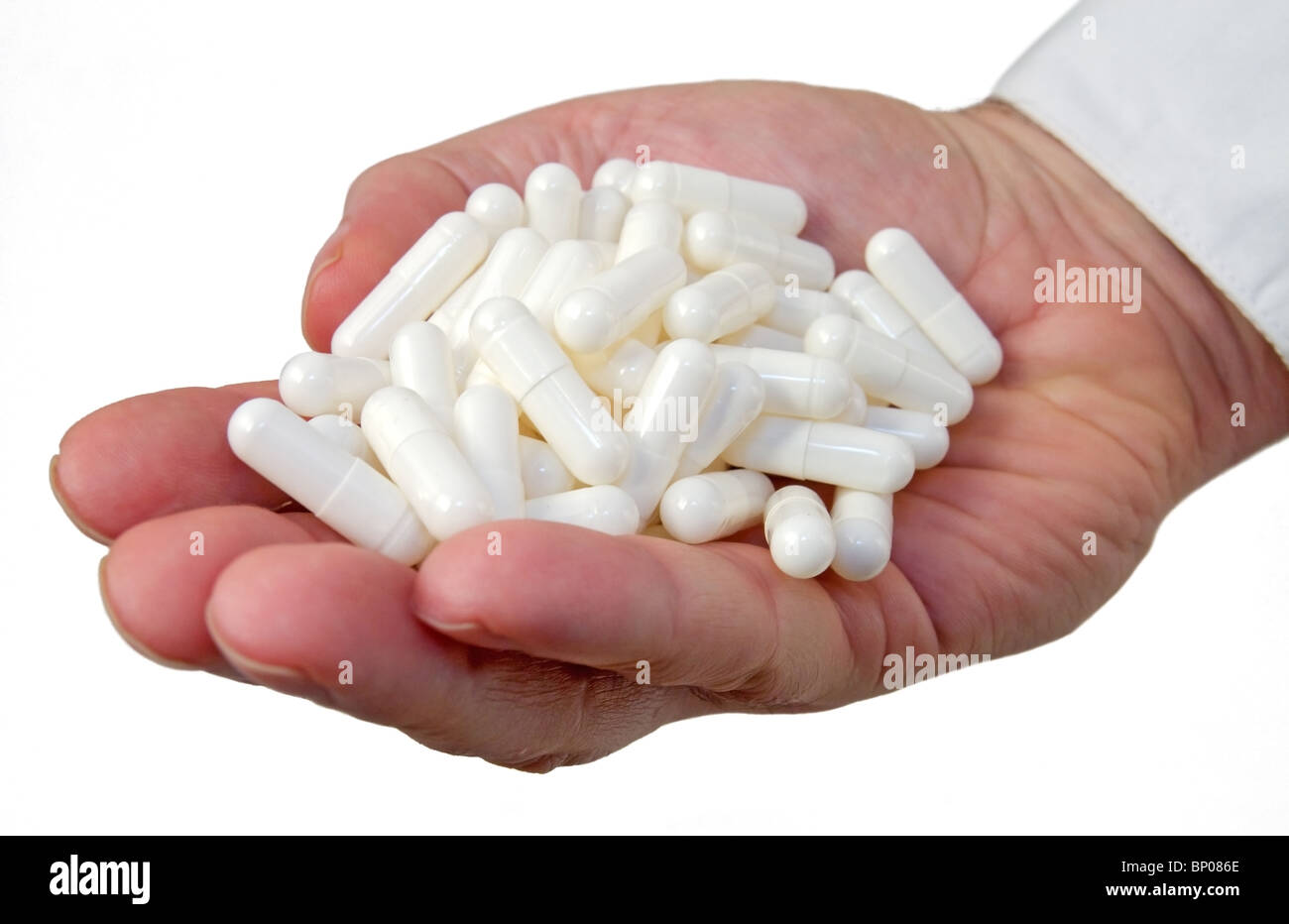 capsule in open hand Stock Photo - Alamy