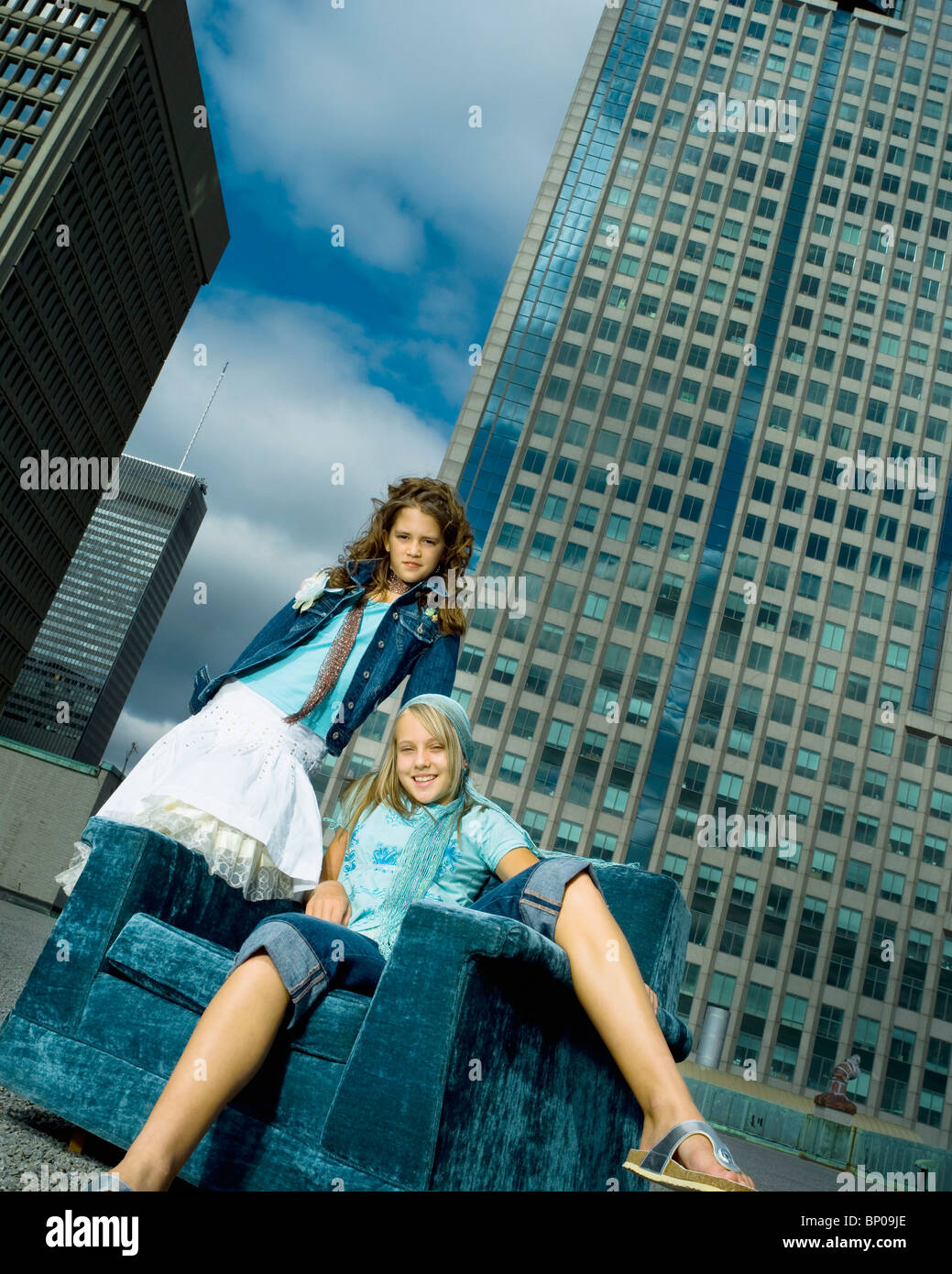 2 teenage girls on building roof Stock Photo - Alamy