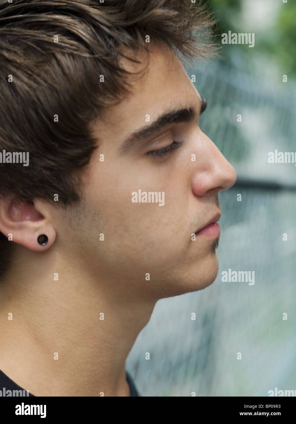 Portrait of teenage boy in profile Stock Photo - Alamy