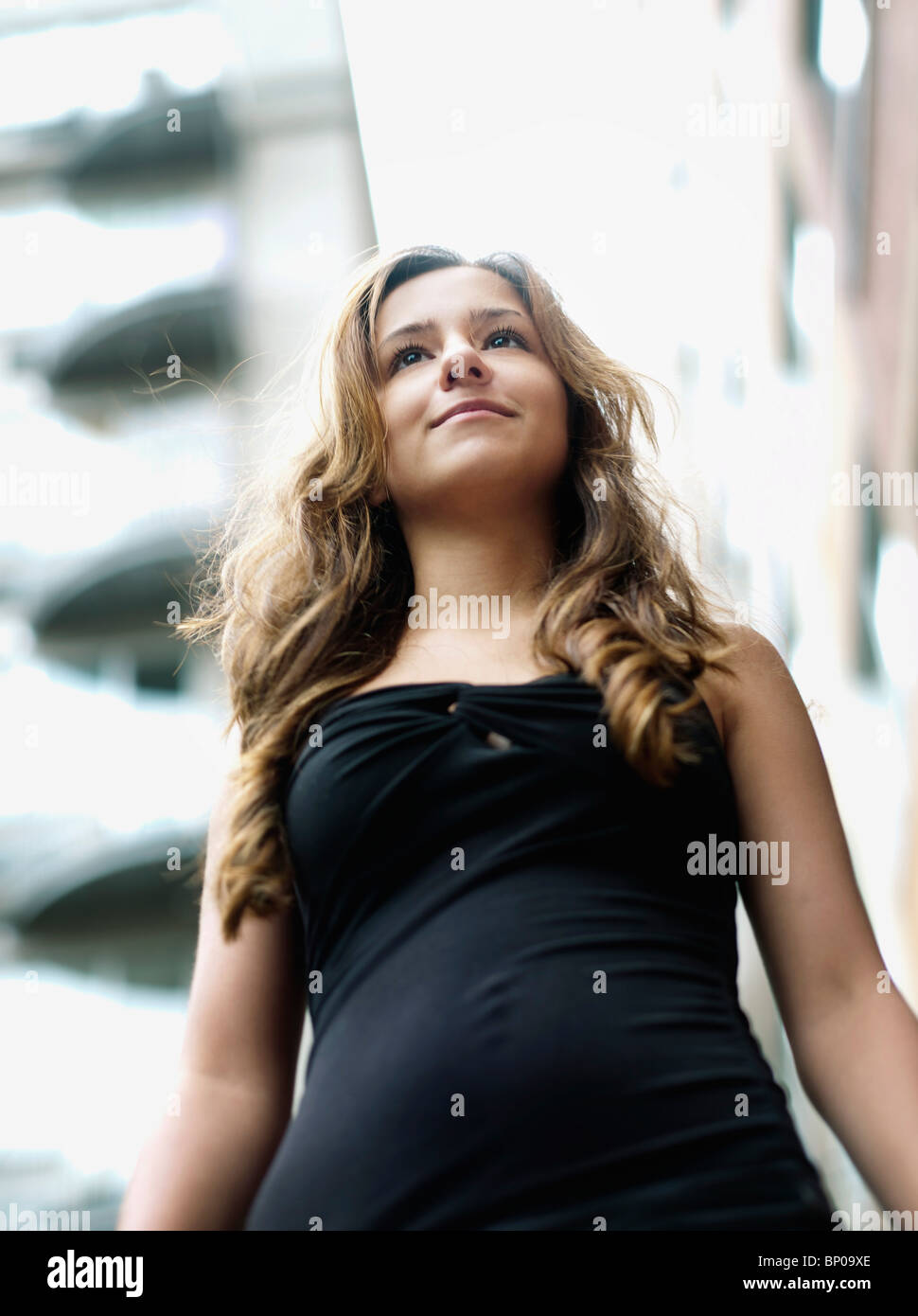 Teenage girl smiling, low angle view Stock Photo - Alamy