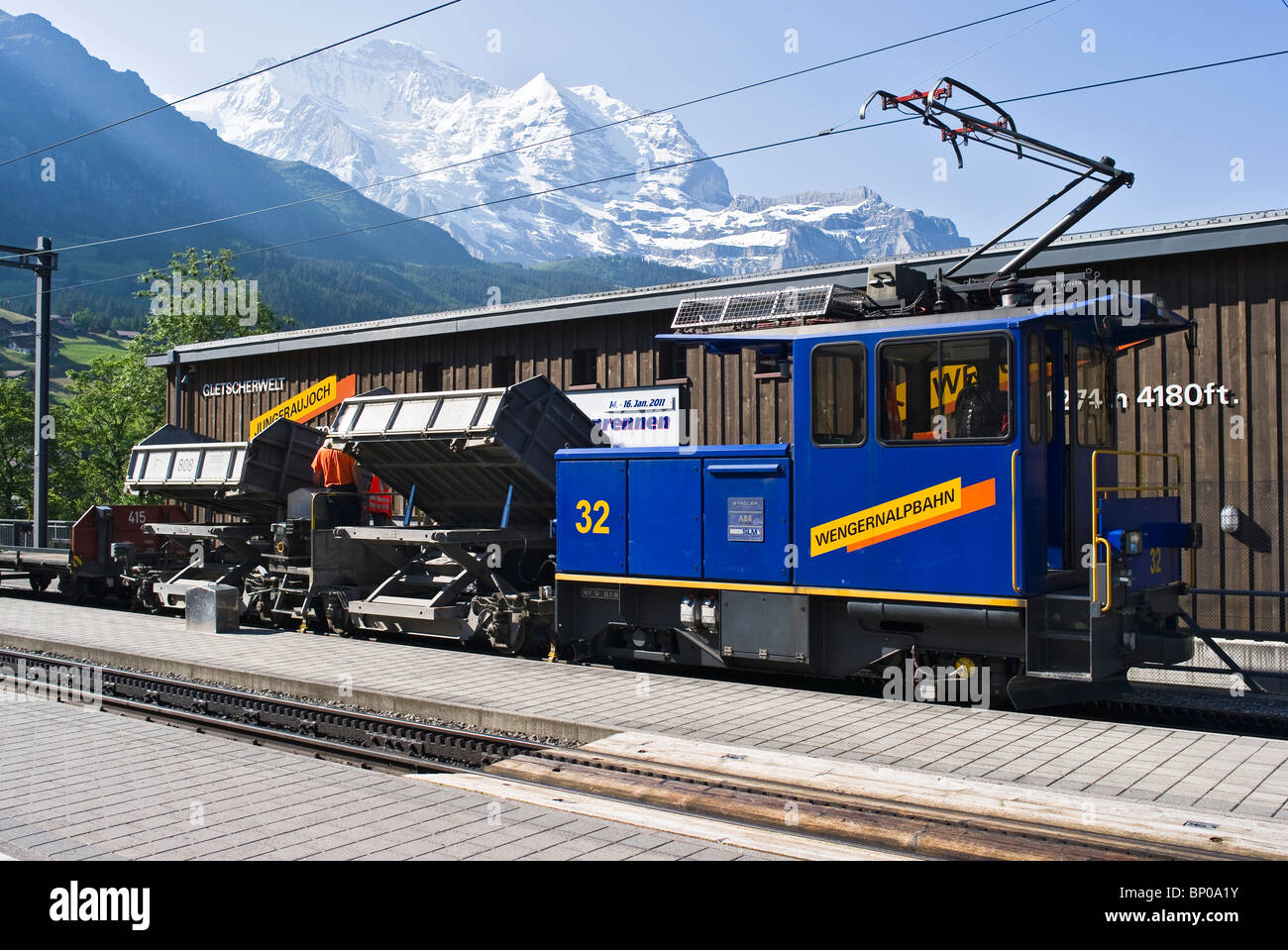 Railway maintenance train unloading aggregate in Wengen Switzerland ...