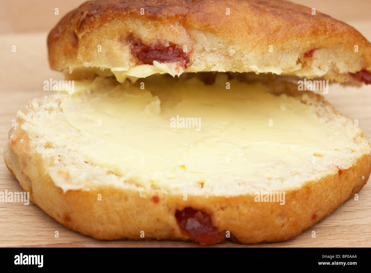 single cherry scone halved and buttered Stock Photo - Alamy