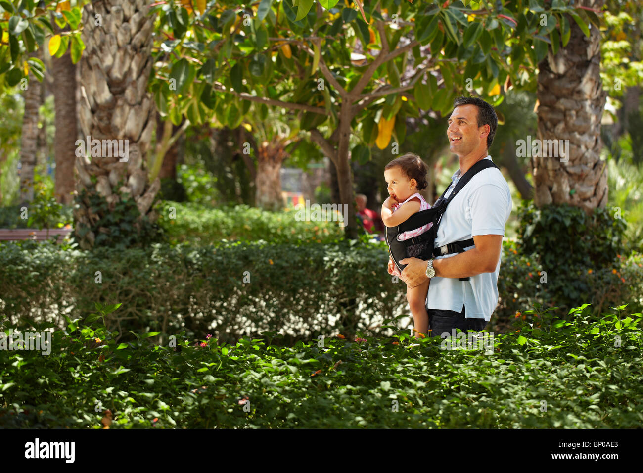 Father walking with baby in park Stock Photo - Alamy