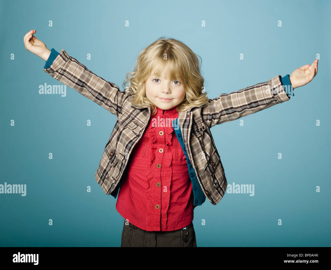 Little girl with arms outstreched Stock Photo - Alamy