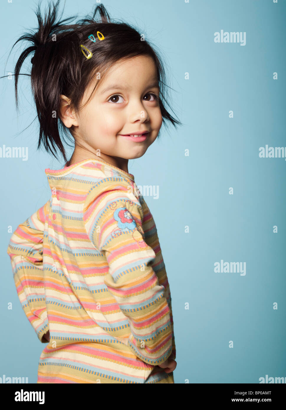 Little girl with arms akimbo Stock Photo - Alamy