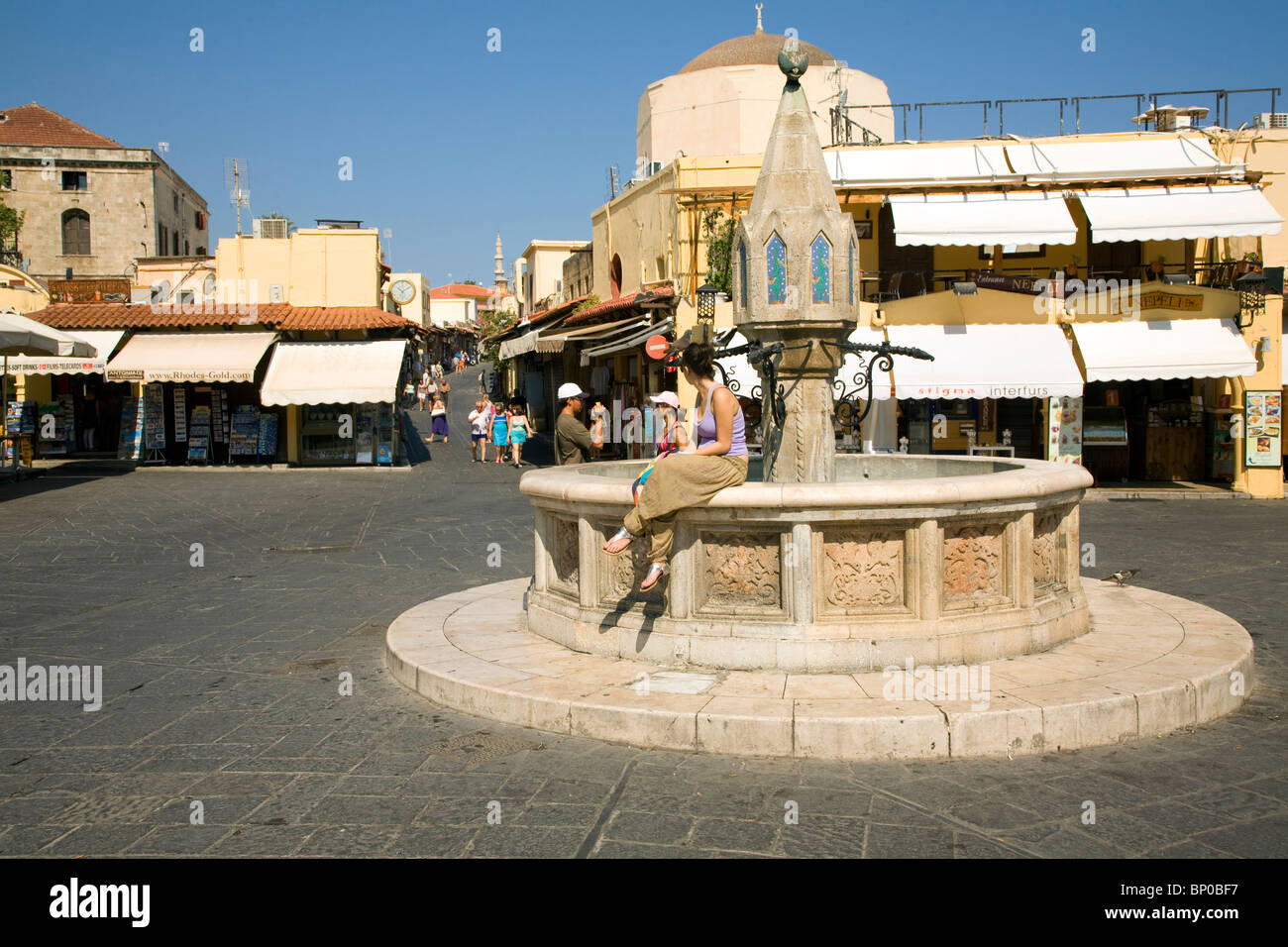Place Ippokratous square and fountain, Rhodes town, Greece Stock Photo ...