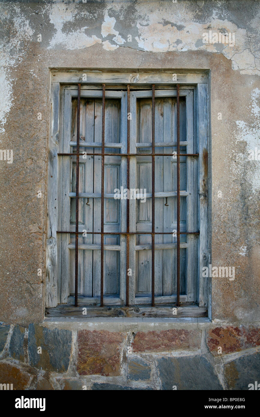Barred and shuttered window Stock Photo - Alamy