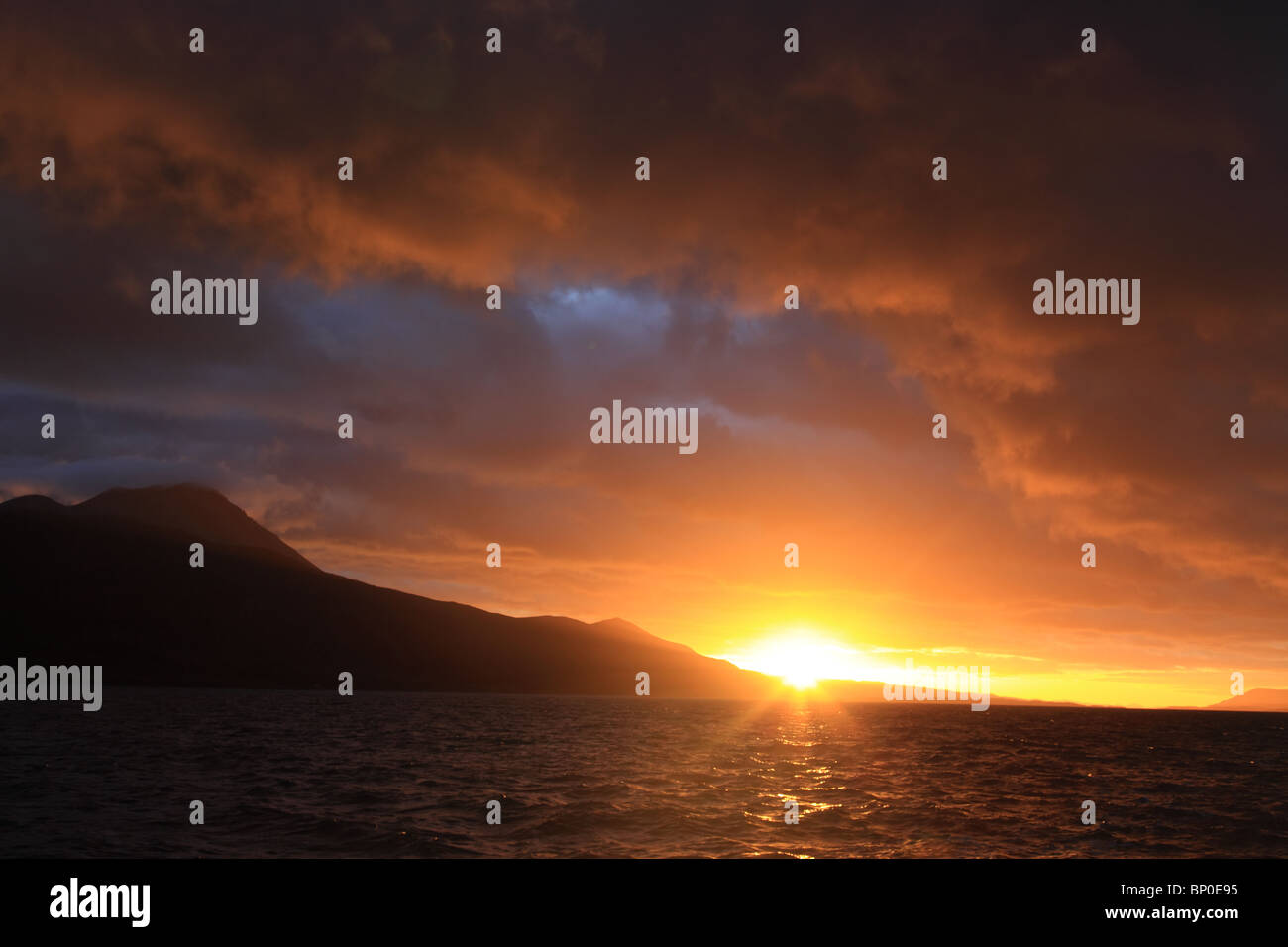 Colorful sunset in the Caribbean over ocean Stock Photo - Alamy