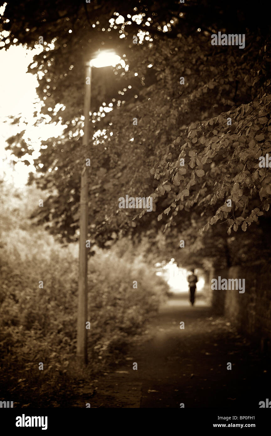 Distant person walking street shadow hi-res stock photography and ...
