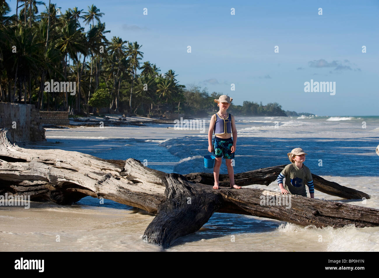 Kenya, Coast, Diani Beach. Two boys play on the Galu Beach. (MR Stock ...