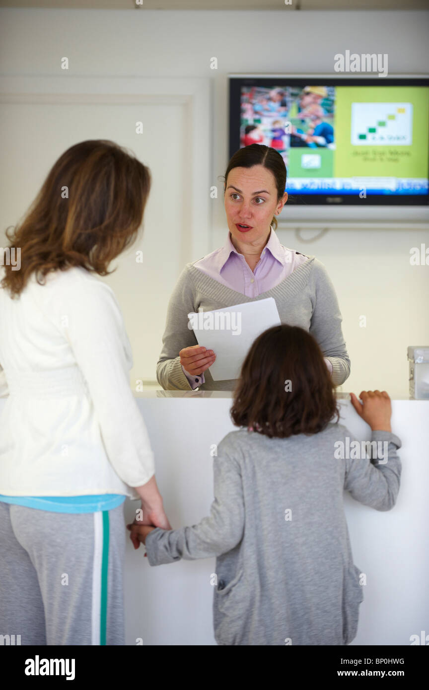 Receptionist in Doctor surgery Stock Photo - Alamy