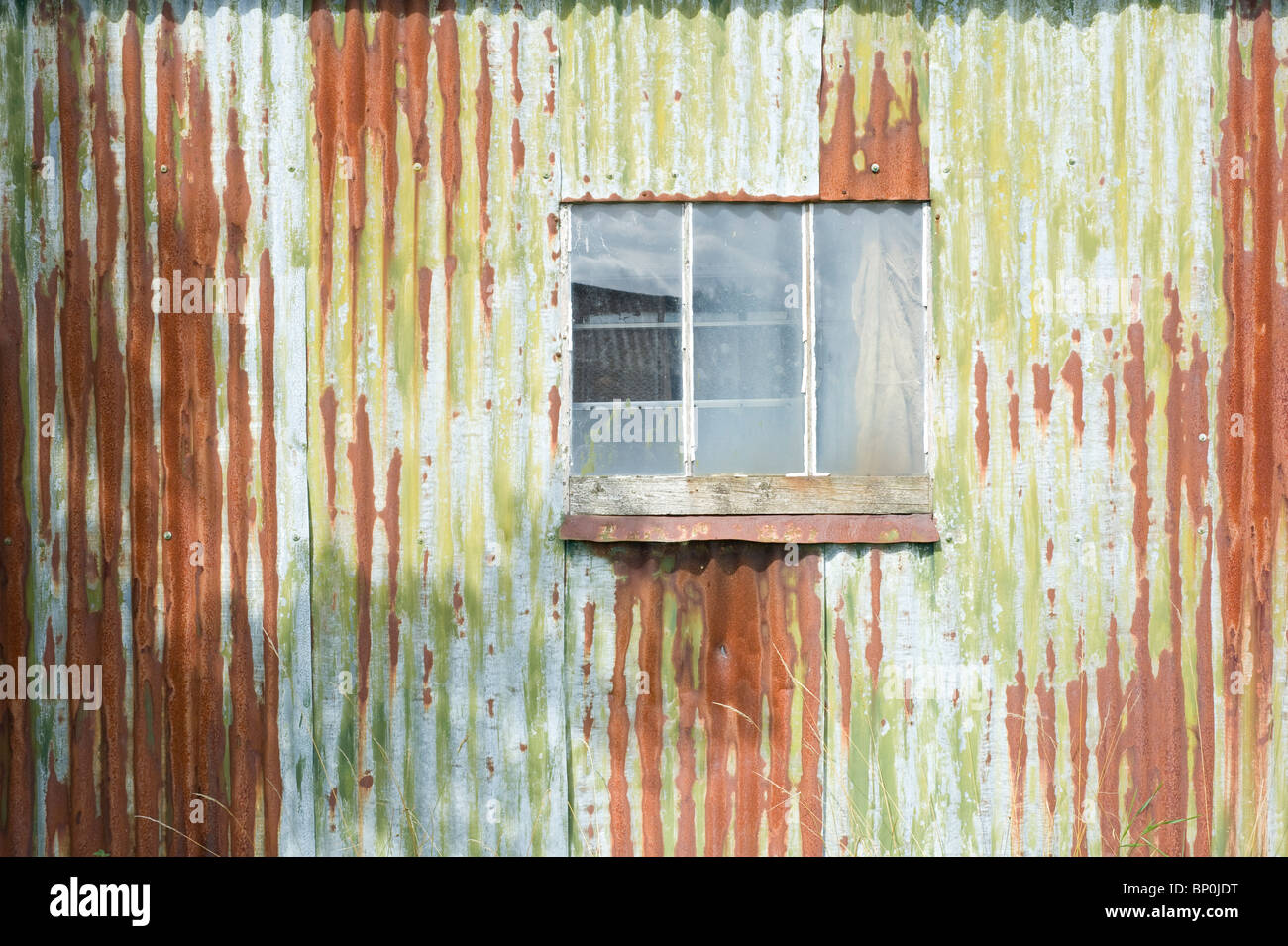Window in rusty corrugated iron shed wall, Suffolk, UK Stock Photo - Alamy