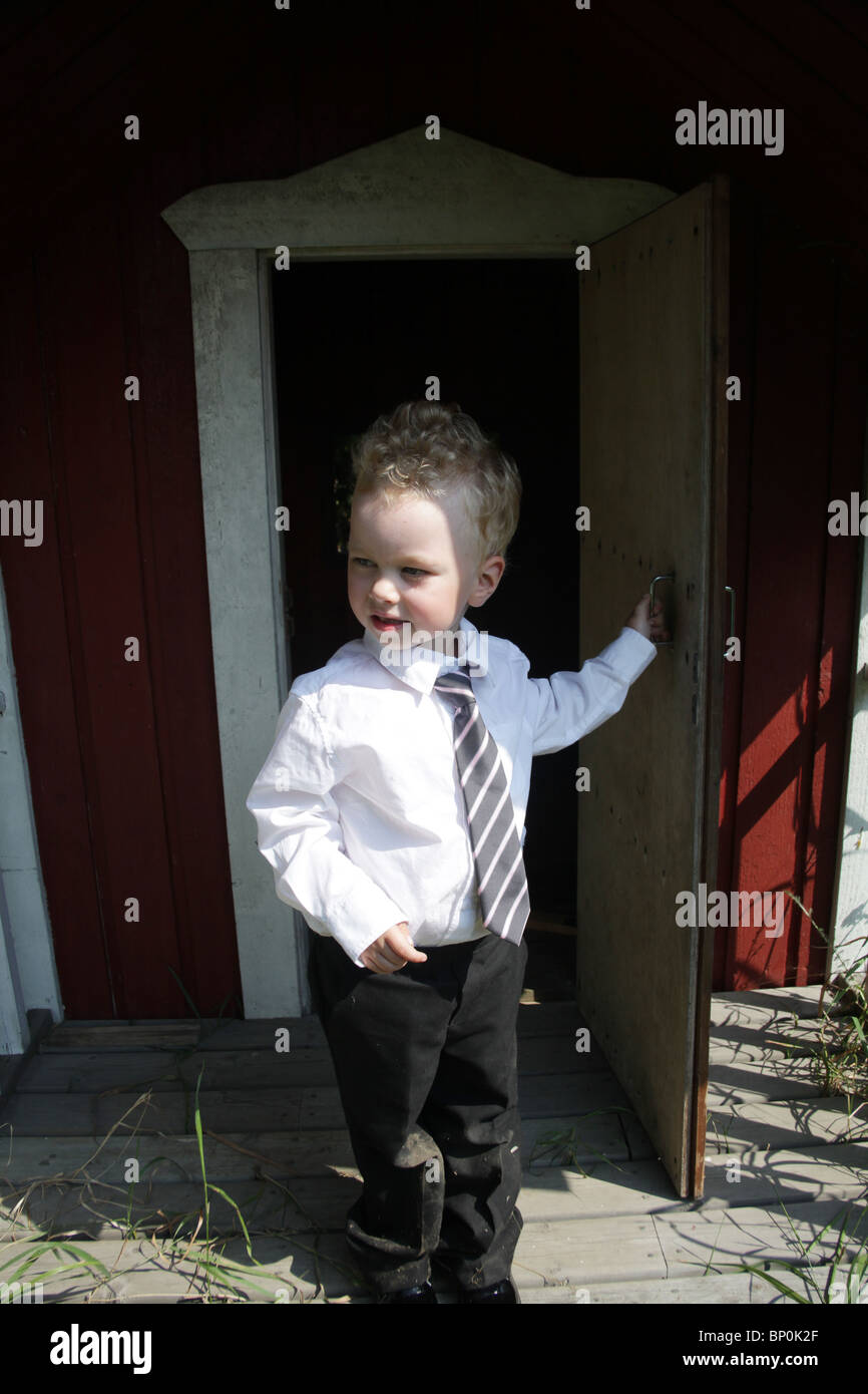 Little boy toddler in party clothes white shirt tie smartly dressed ...