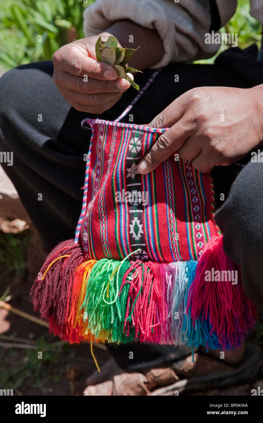 Peru, A hand-woven bag for coca leaves on Taquile Island. Coca has been ...