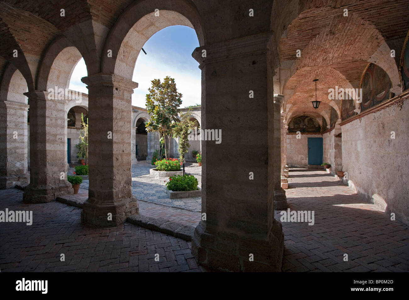 Peru, Vaulted walkways around a courtyard garden in the magnificent ...