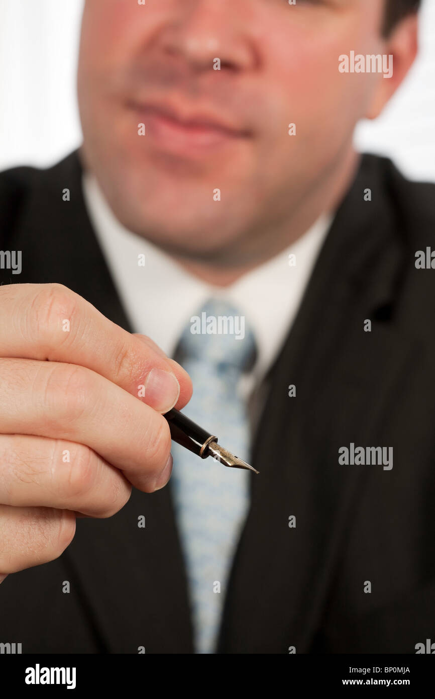 Businessman with Fountain Pen Stock Photo - Alamy