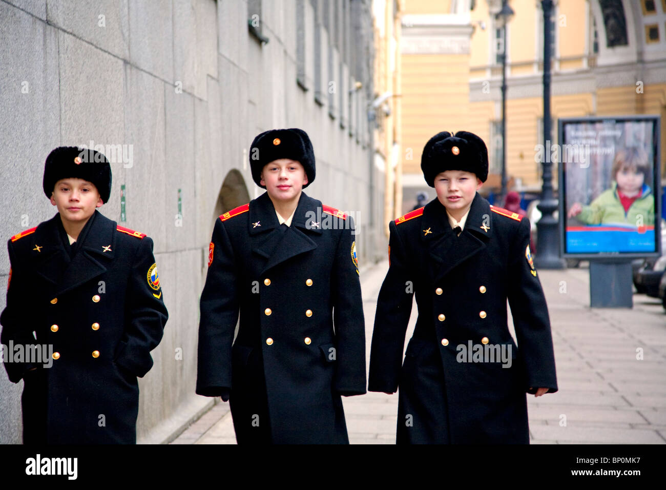 Russia, St. Petersburg; Three young cadets walking in the main streets ...