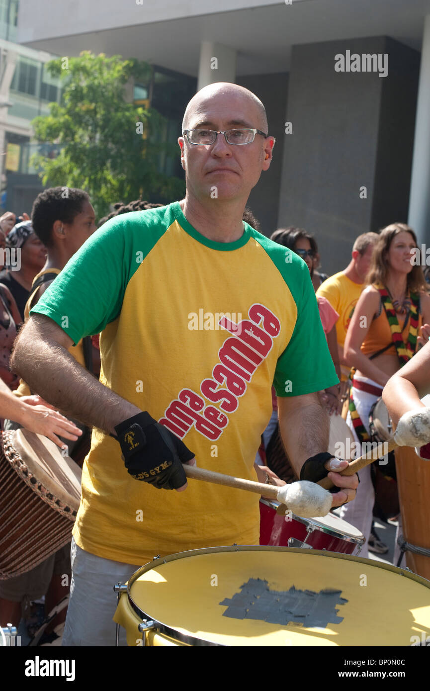 Man beating the drum during a Brazilian festival at the Southbank in ...