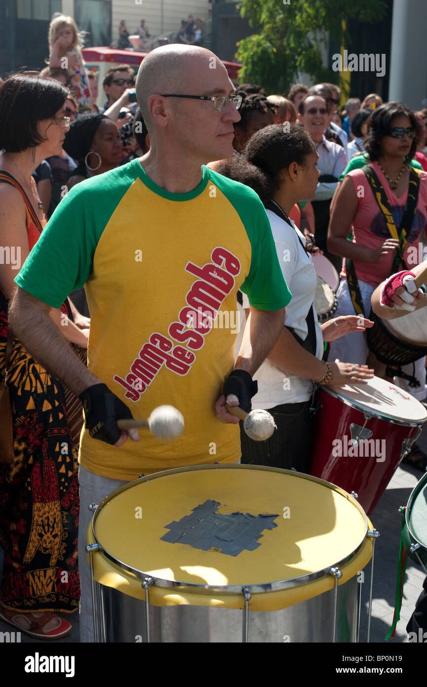 Man beating the drum during a Brazilian festival at the Southbank in ...