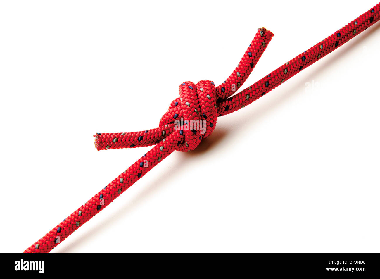 A knot on very strong climber red rope Stock Photo - Alamy