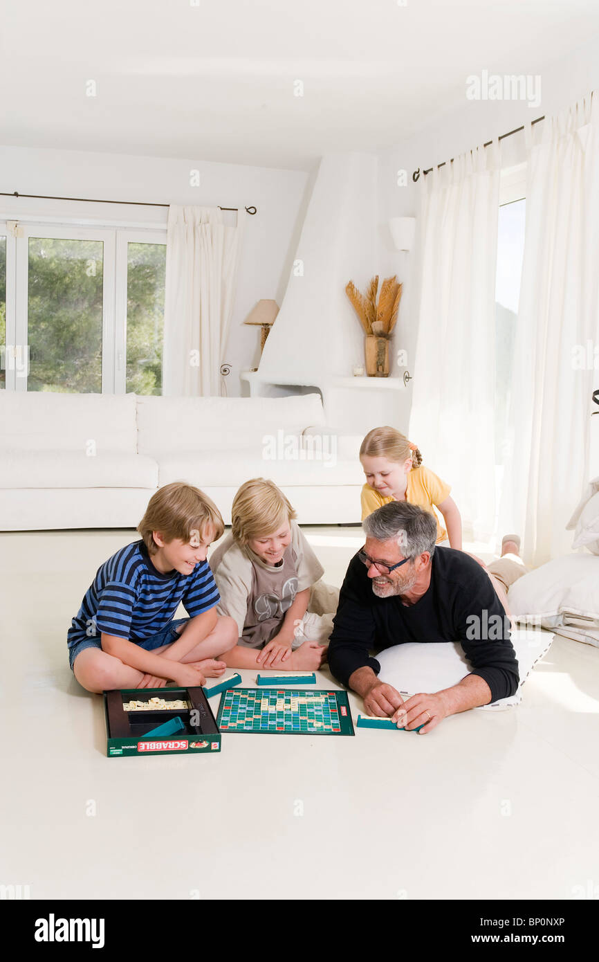 Family playing scrabble Stock Photo - Alamy