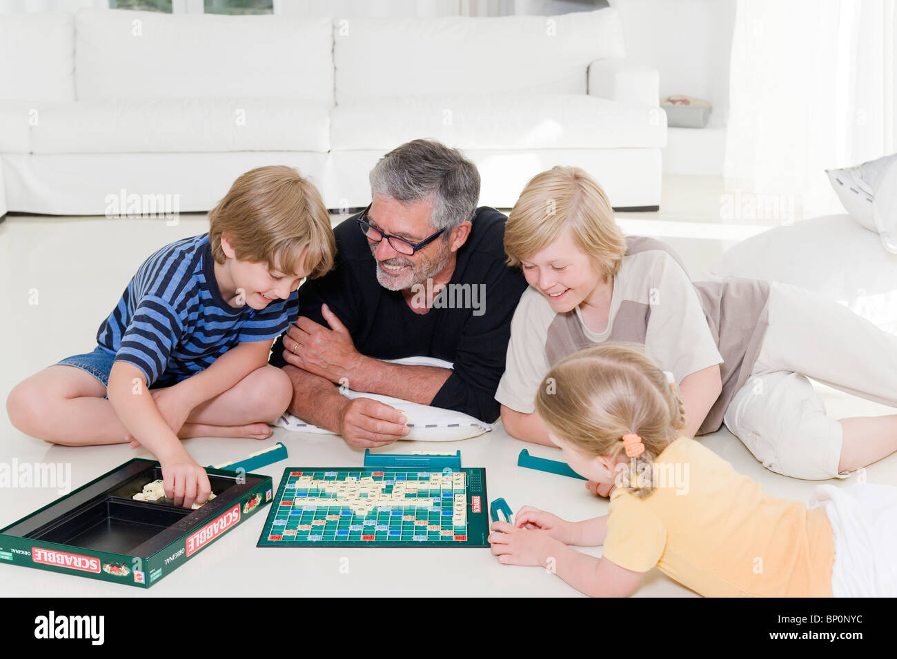 Family playing scrabble Stock Photo - Alamy