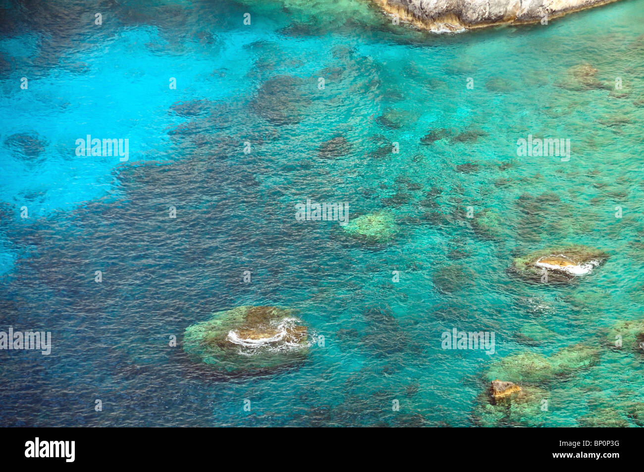 Crystal clear blue sea water at rocky beach in Zakynthos, Greece Stock ...