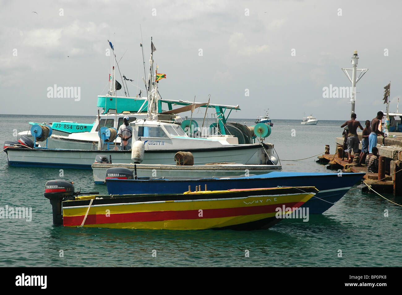 There are a variety of colorful boats, both commercial and pleasure, at ...