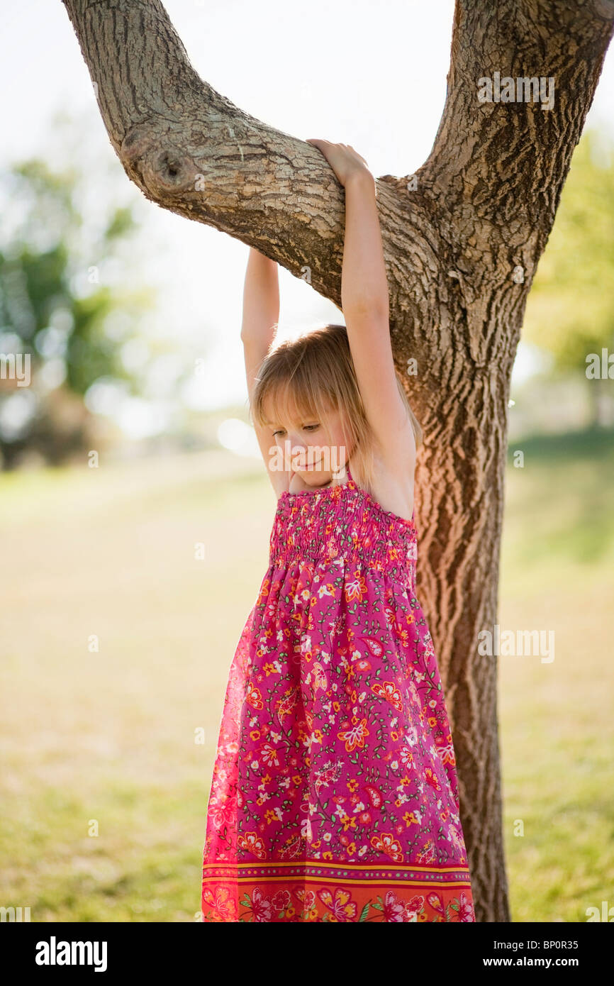 Girl Hanging From Tree