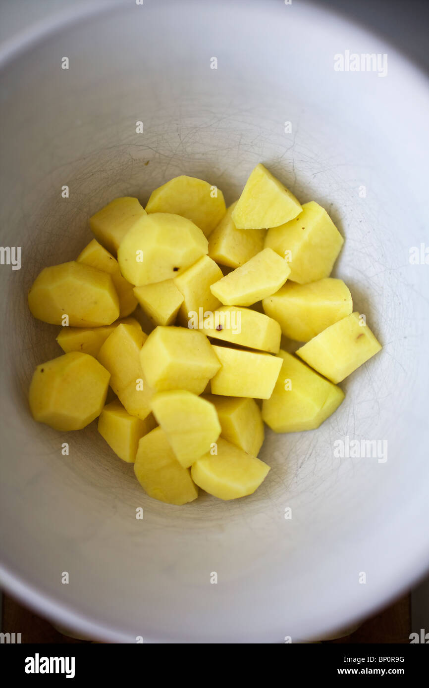 Potatoes being prepared for cooking Stock Photo - Alamy