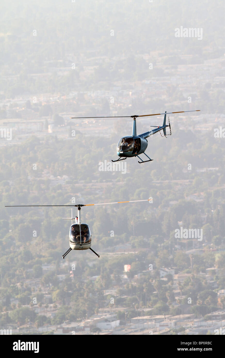 Helicopters Fly Over The Hollywood Hills Stock Photo - Alamy