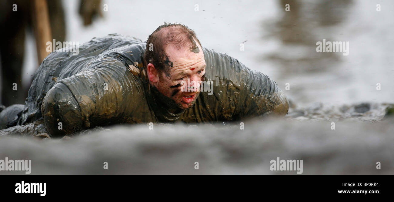 A competitor struggles to get to the finish line during the Maldon Mud ...