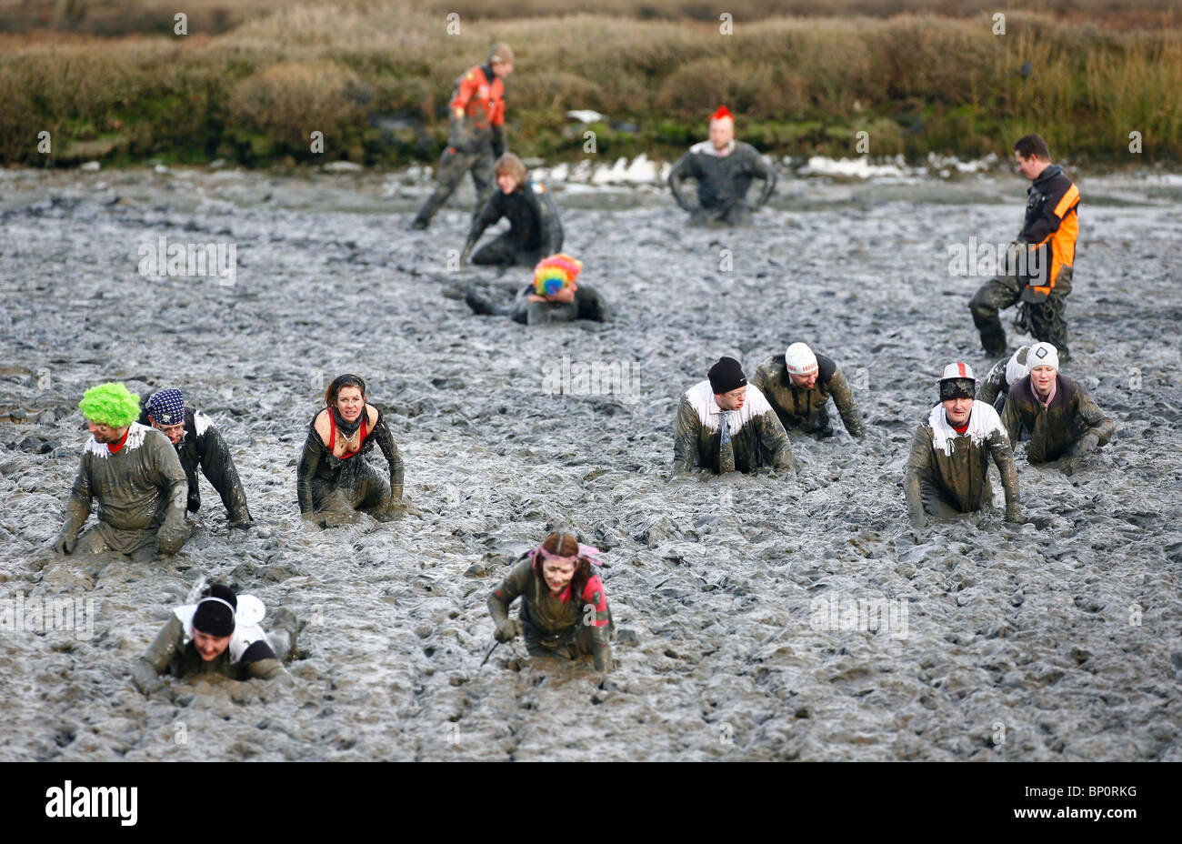 Competitors struggle to get to the finish line during the Maldon Mud ...