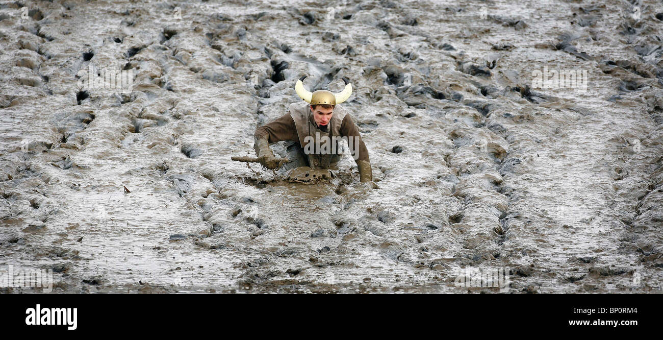 A competitor struggles to get to the finish line during the Maldon Mud ...