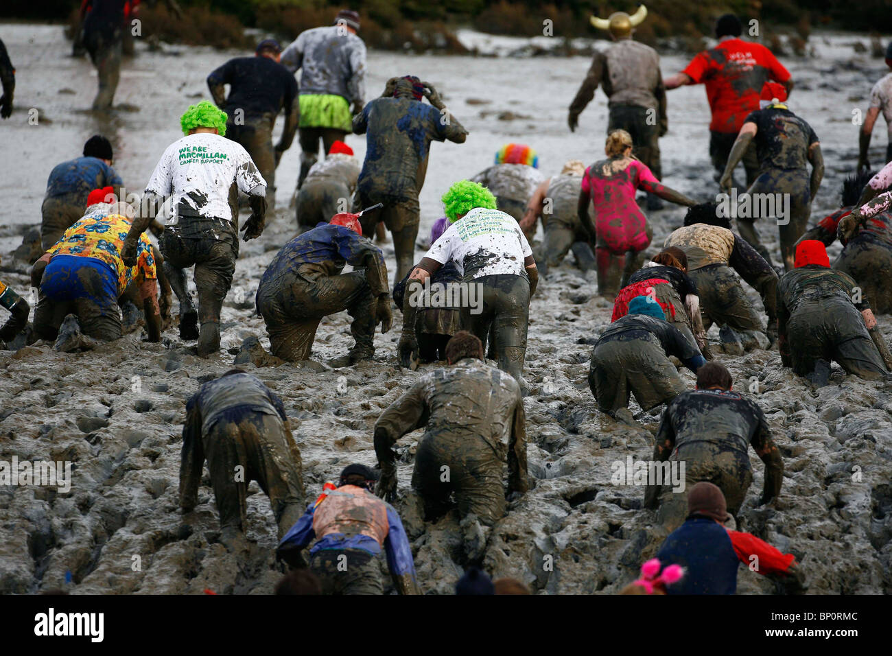 Competitors struggles to get to the finish line during the Maldon Mud ...