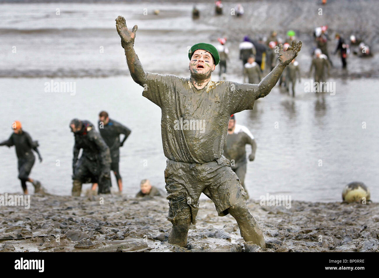 A competitor struggles to get to the finish line during the Maldon Mud ...
