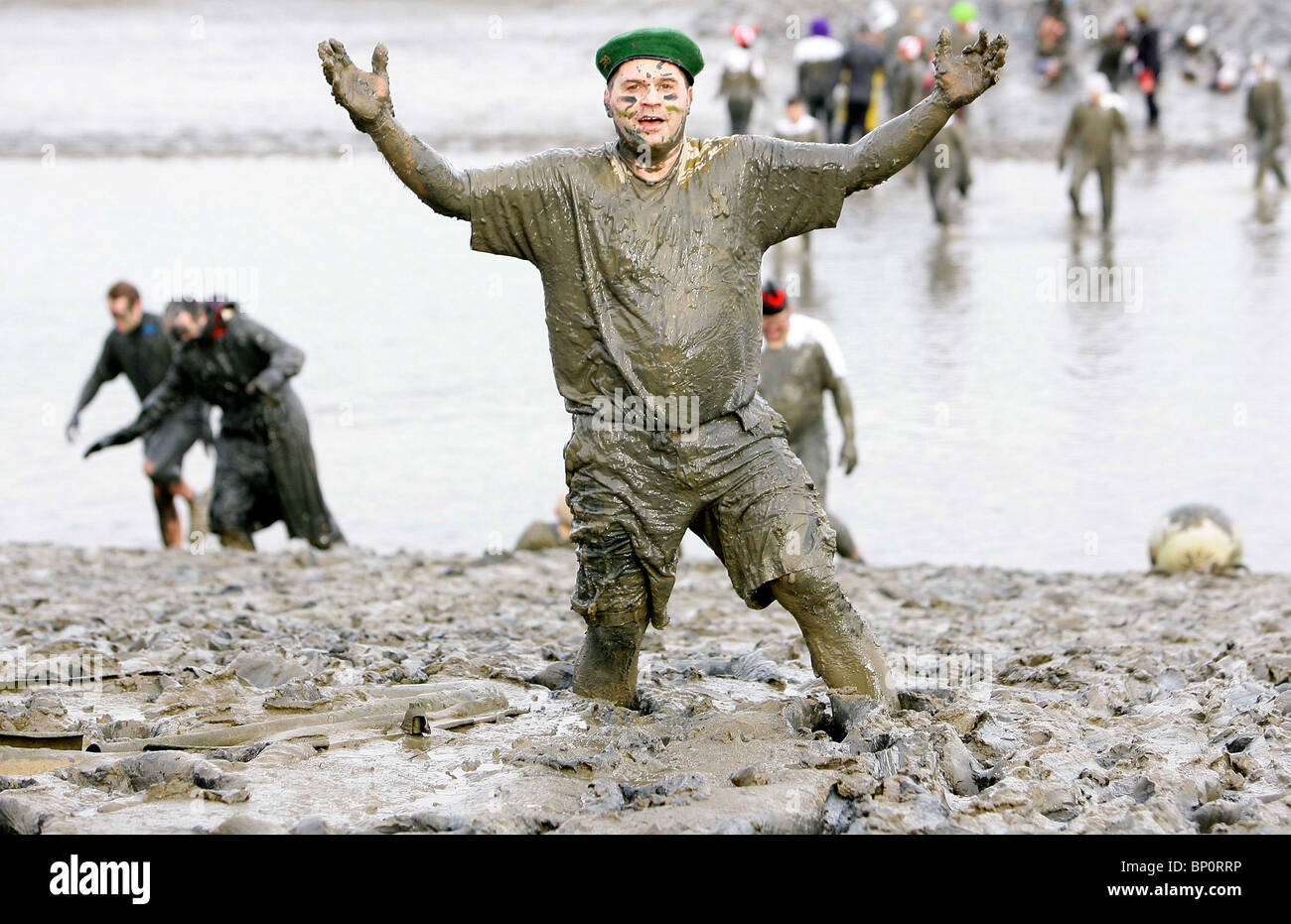 A competitor struggles to get to the finish line during the Maldon Mud ...