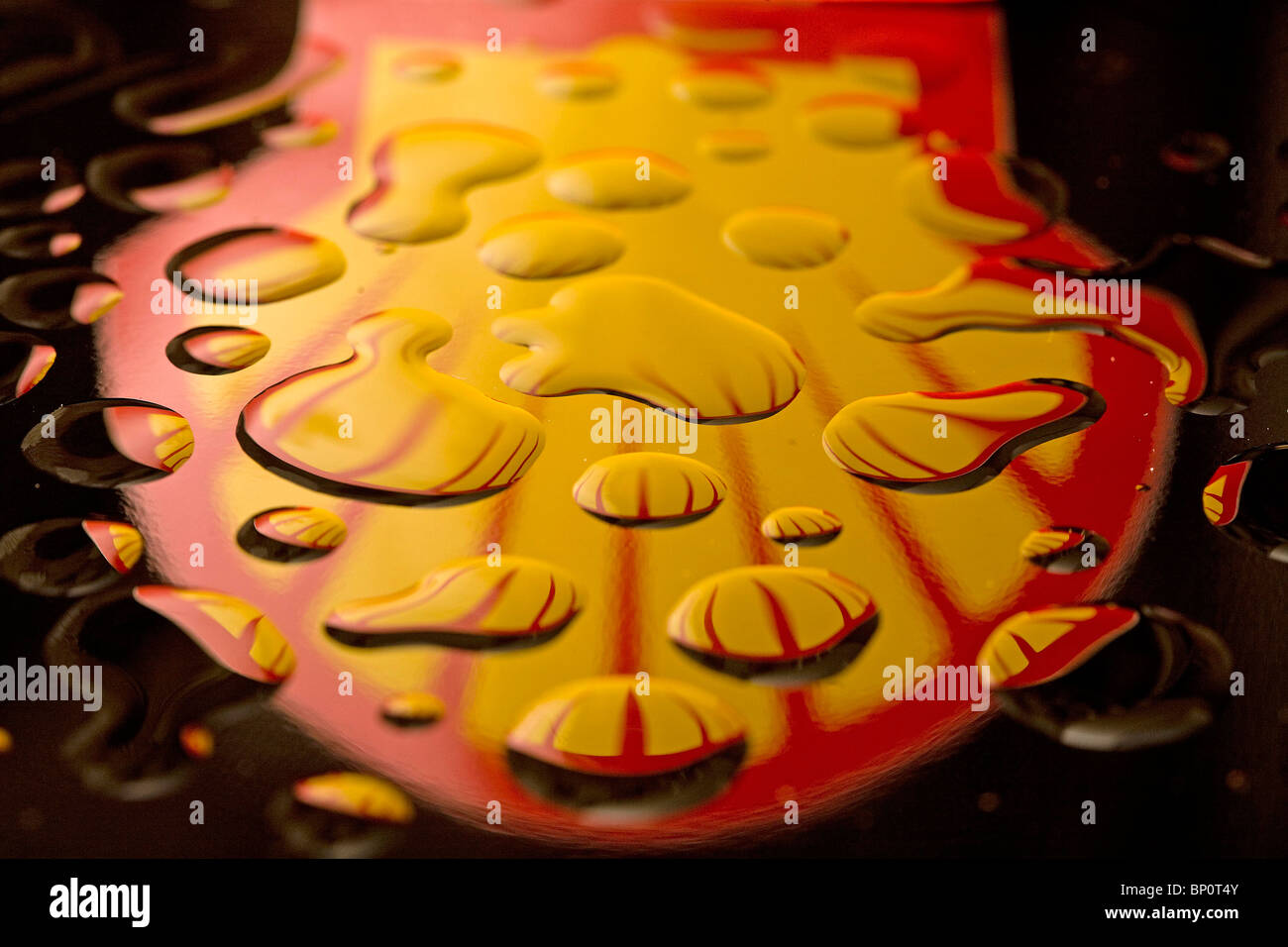 A shell logo is seen reflected in droplets of motor oil. Picture by ...