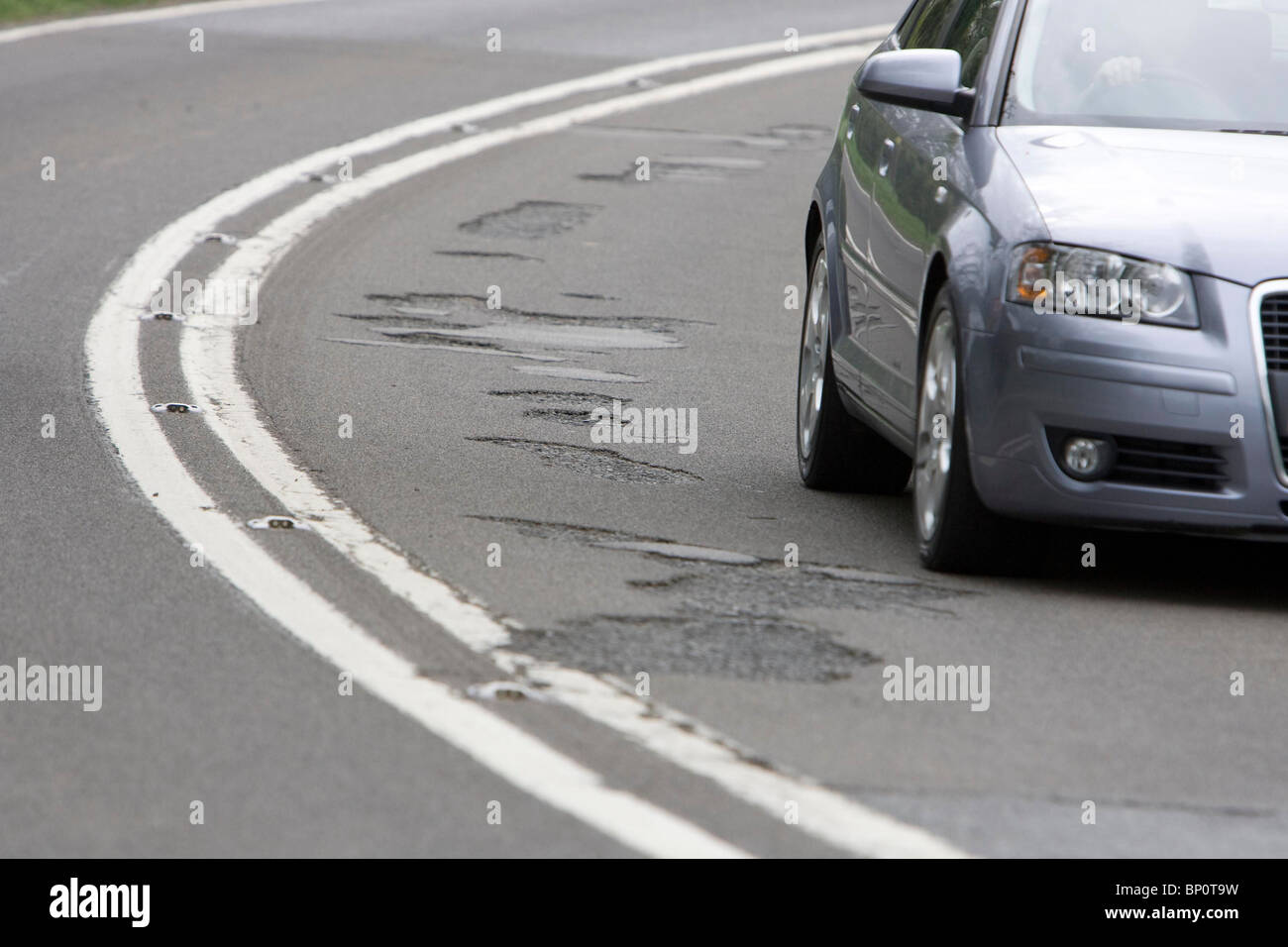 Car driving past potholes hi-res stock photography and images - Alamy