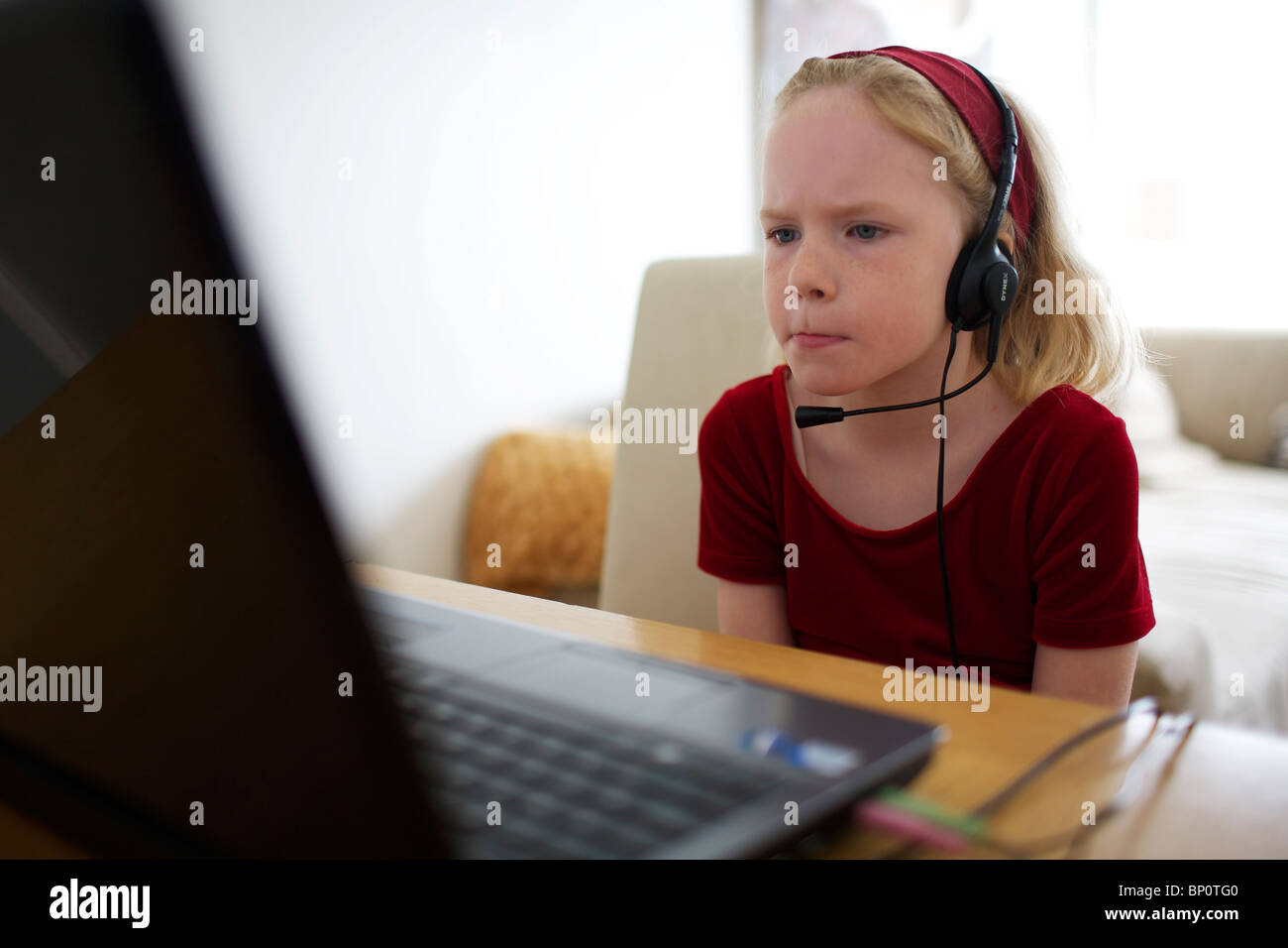 Young girl on the computer Stock Photo - Alamy