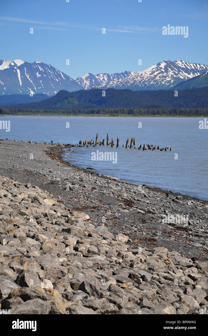 Shore view of Resurrection Bay and snow capped mountains, Seward ...