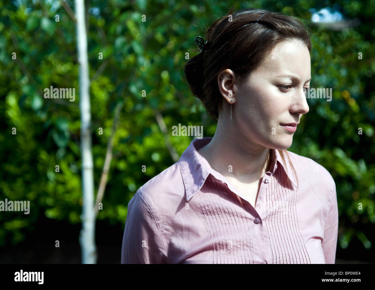 Portrait of woman deep in thought Stock Photo - Alamy