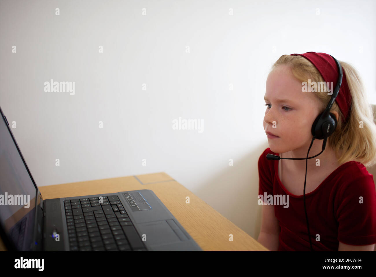 Young girl on the computer Stock Photo - Alamy