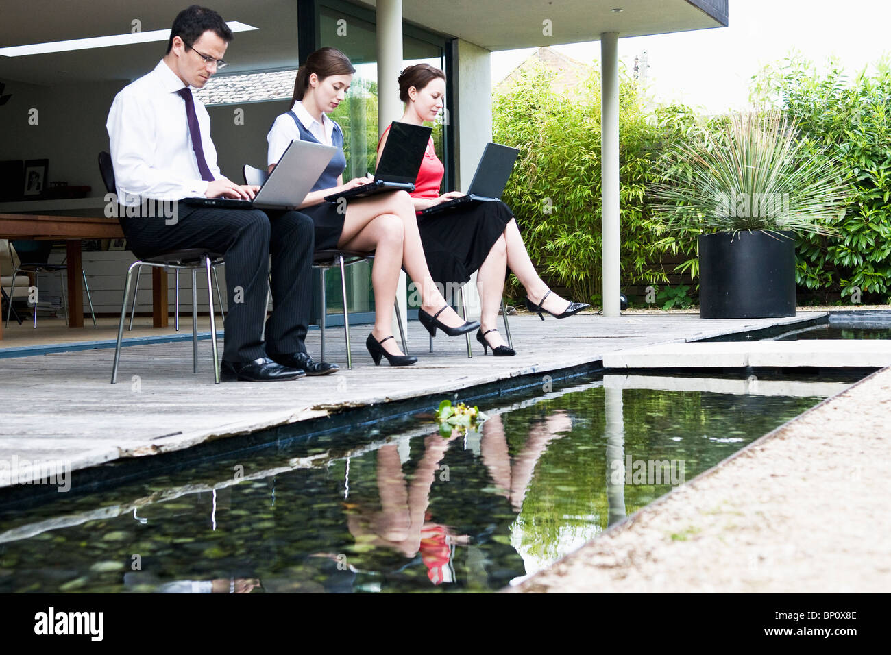 3 colleagues work outdoors Stock Photo - Alamy