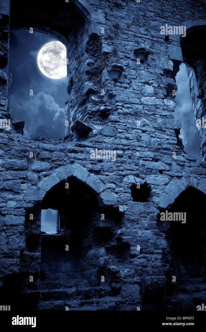 A very spooky Halloween castle in the moonlight Stock Photo - Alamy