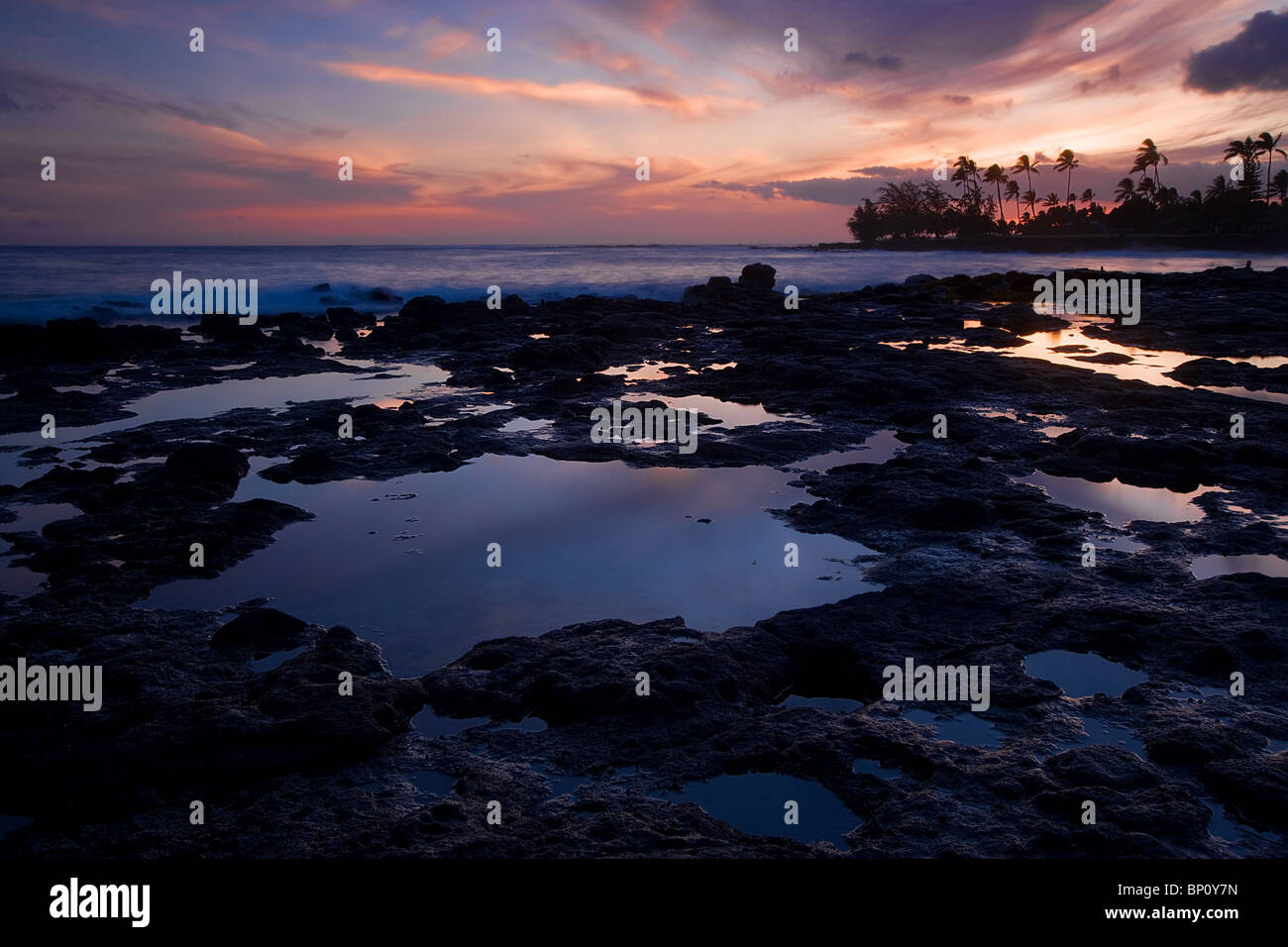 Dusk sky over lava pools at Brenneke Beach, Poipu, Kauai, Hawaii Stock ...