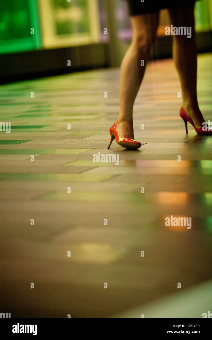 Woman walking in street heel hi-res stock photography and images - Alamy