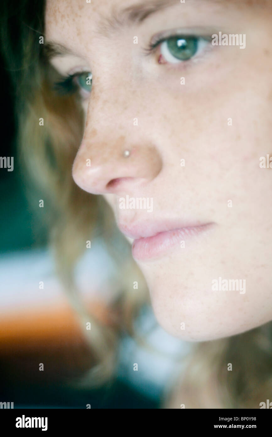 Portrait of young woman thinking Stock Photo - Alamy