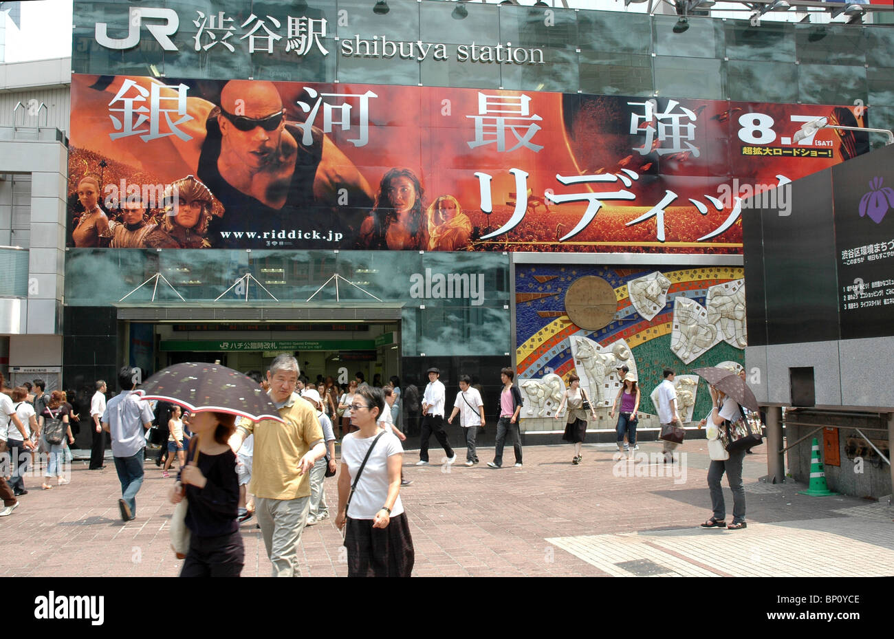 The Main Shibuya Train Station Entrance With People In The Street ...