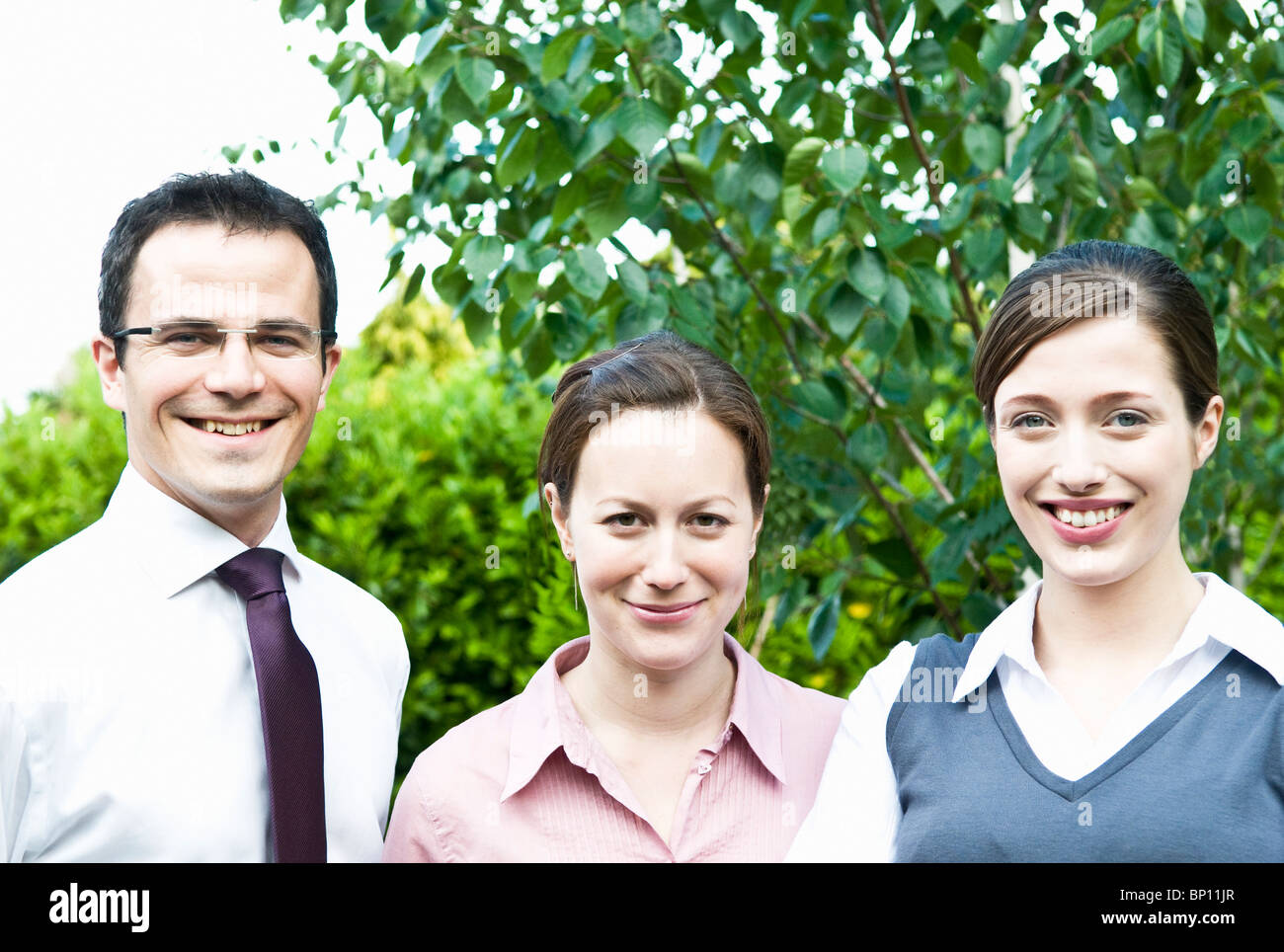 Three happy colleagues outdoors Stock Photo - Alamy